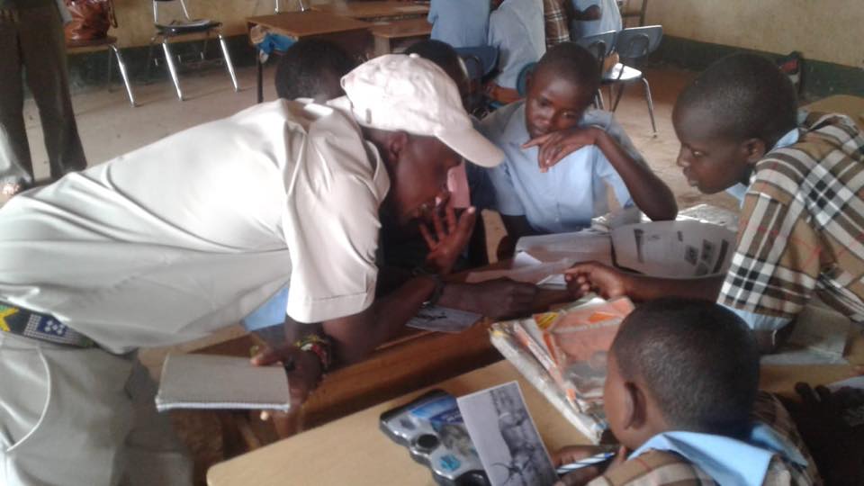 eki the guide with students – Land and Life Foundation